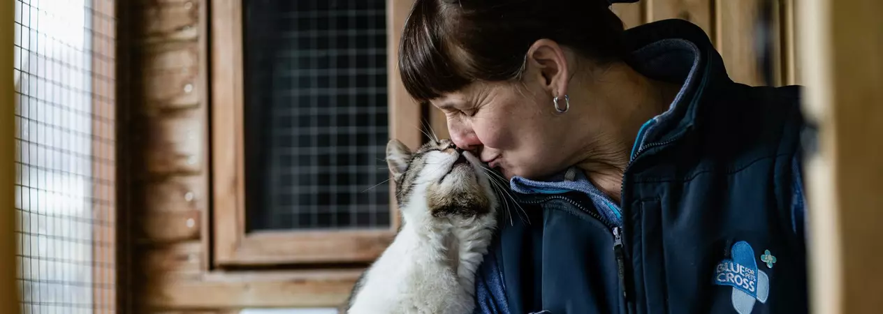 scared mouse holding cross